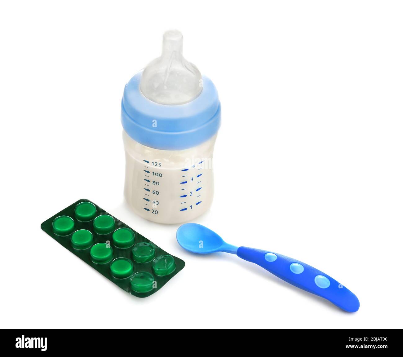 Baby care concept. Baby bottle and pills on white background Stock ...