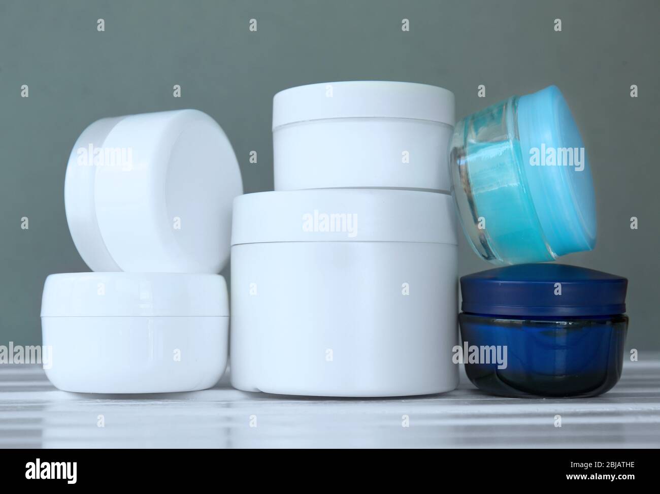 Set of nutritious creams on white table Stock Photo - Alamy