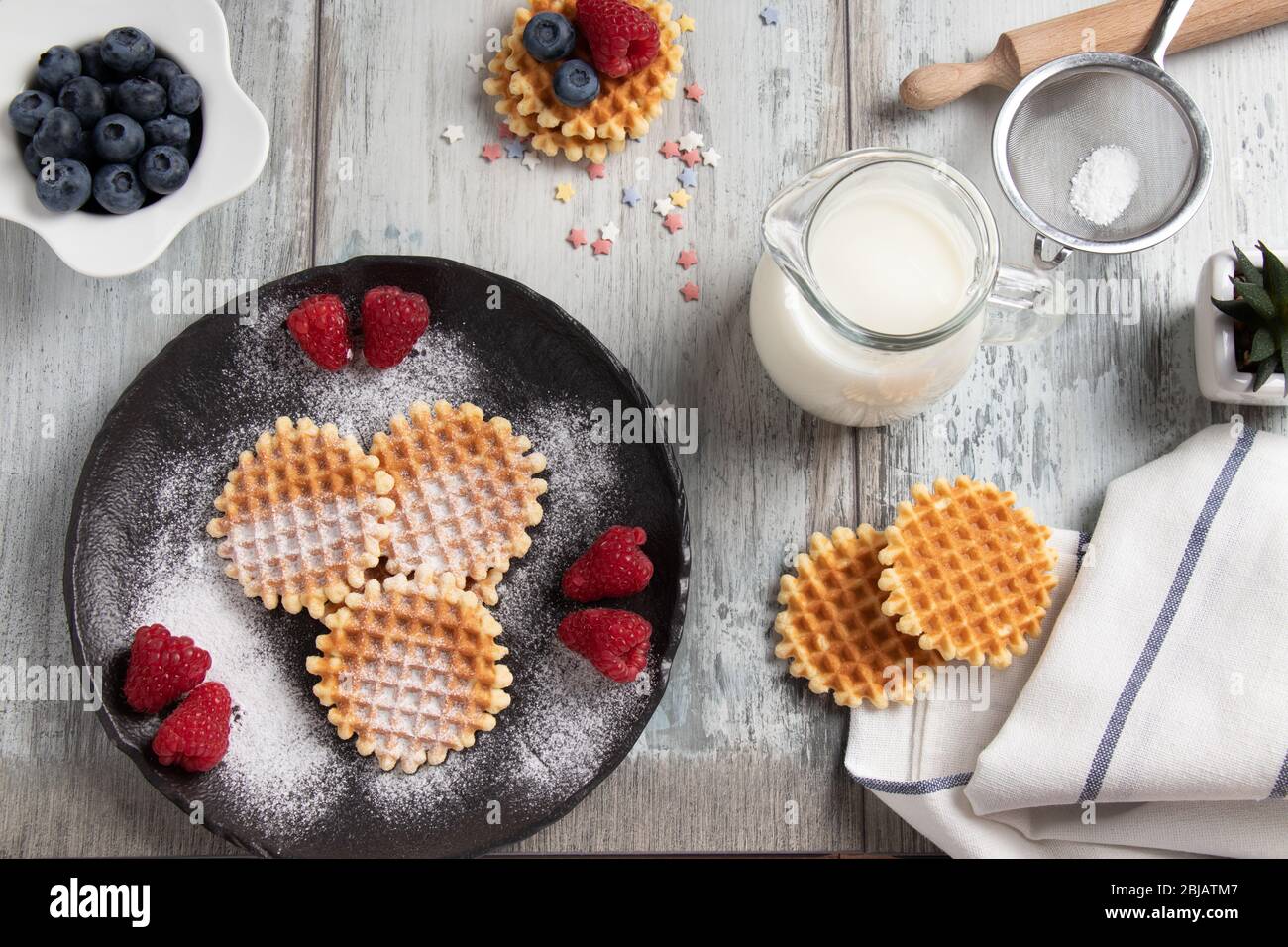 Traditional Belgian waffles with fresh fruit and milk. Flat lay, top ...