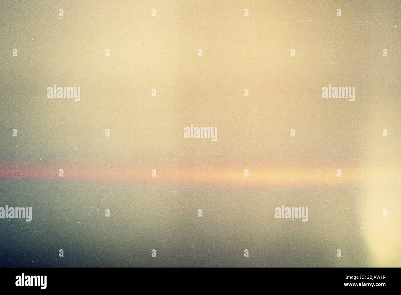 Abstract film texture background with heavy grain, dust and light leak ...