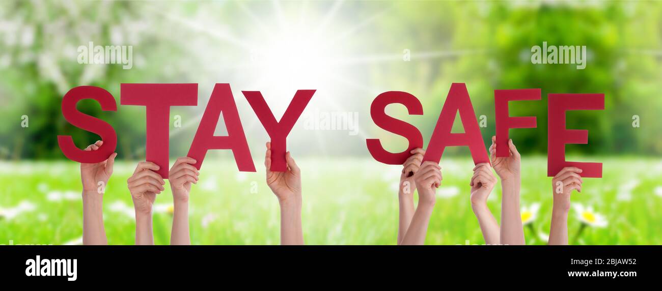 People Hands Holding Word Stay Safe, Grass Meadow Stock Photo - Alamy