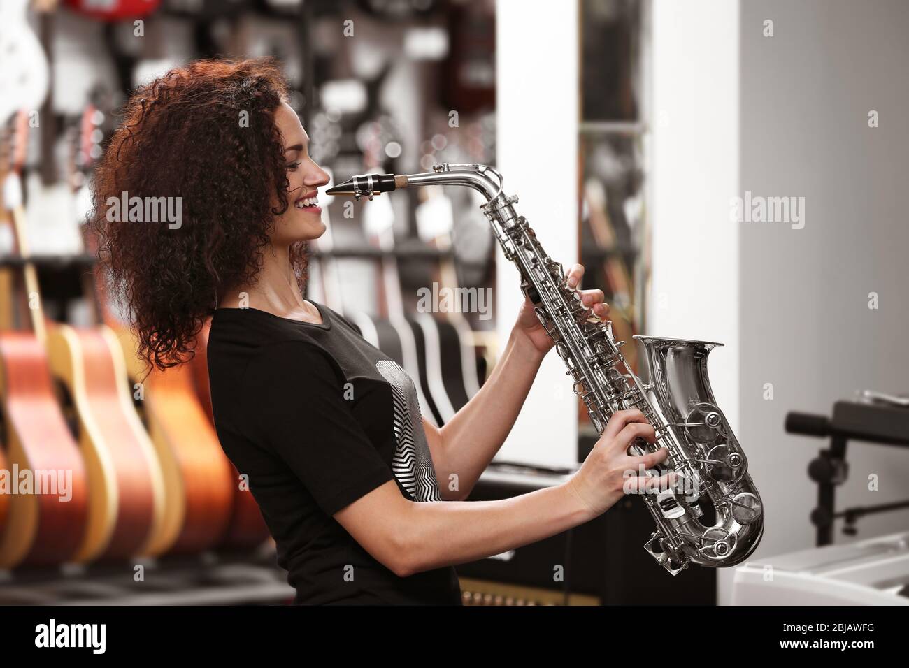 Girl playing sax hi-res stock photography and images - Alamy