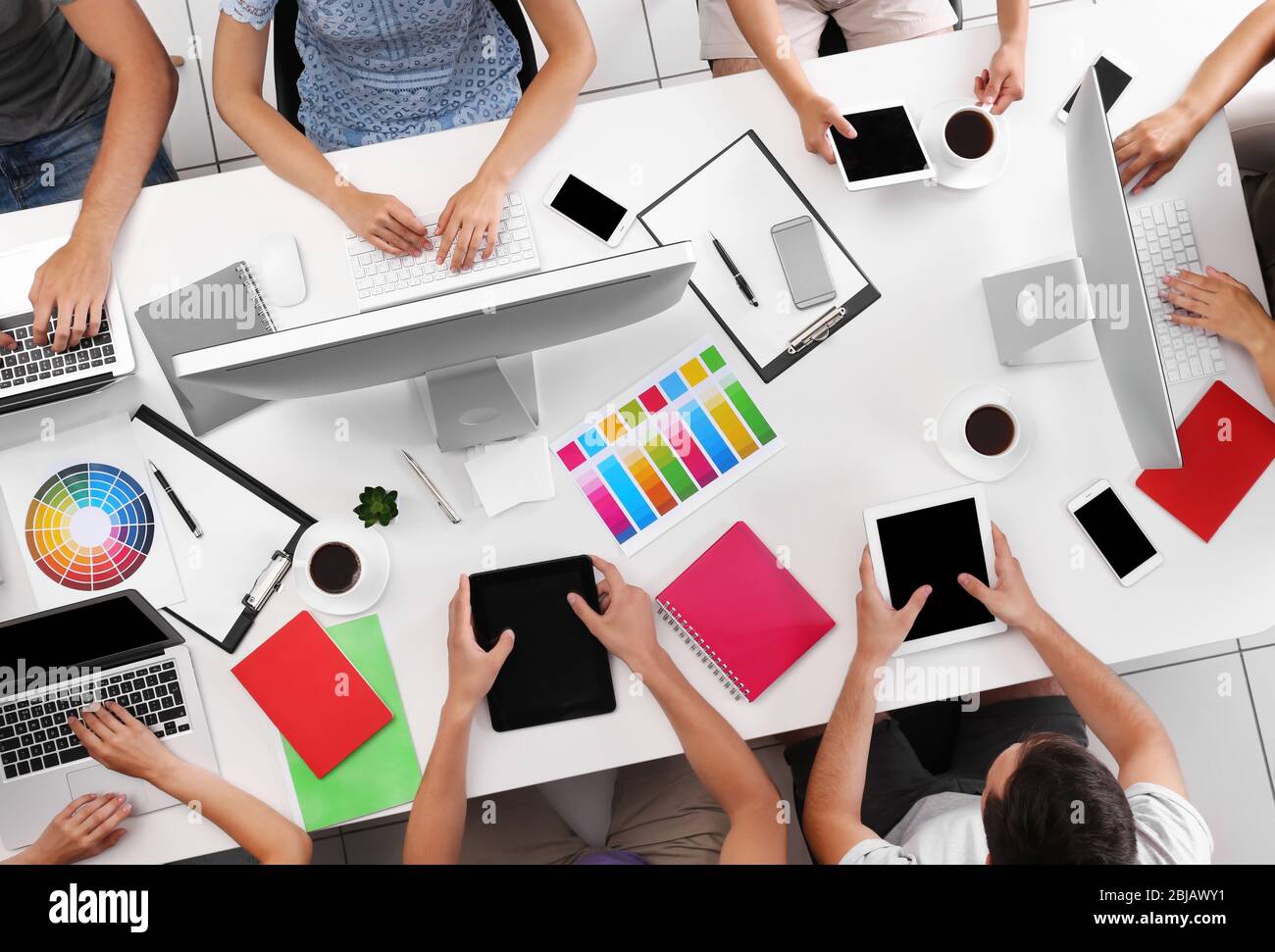 Group of designers working at office Stock Photo - Alamy