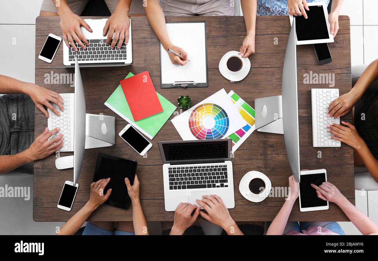 Group of designers working at office Stock Photo - Alamy