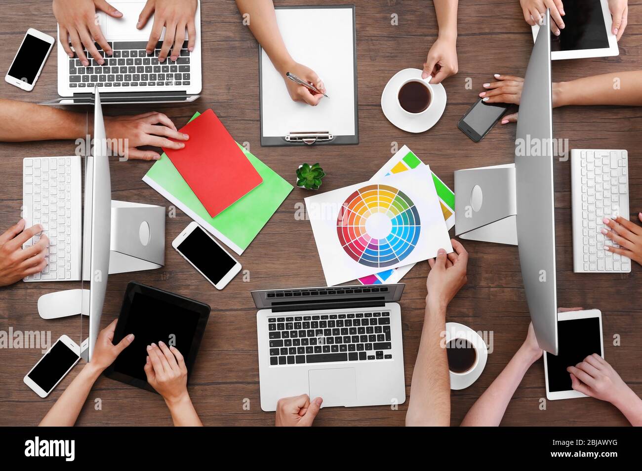 Group of designers working at office Stock Photo - Alamy