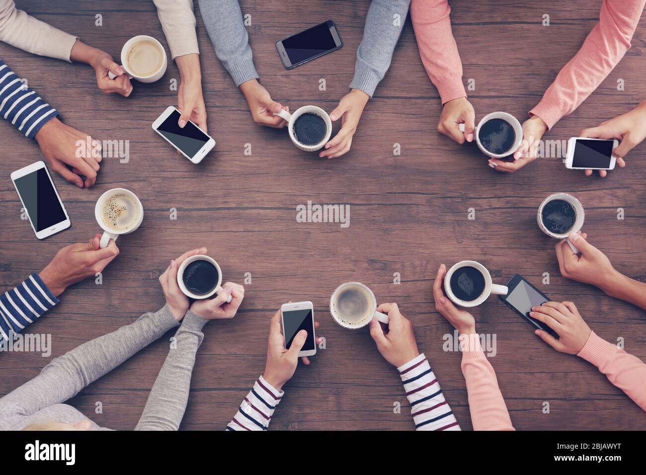 Group of people drinking coffee together Stock Photo - Alamy
