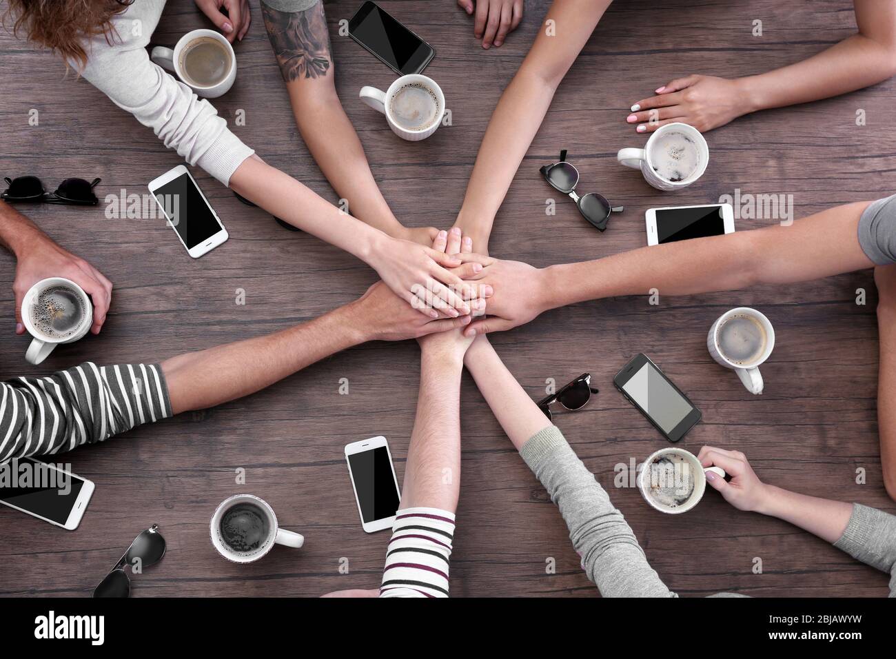 Group of people drinking coffee together Stock Photo - Alamy