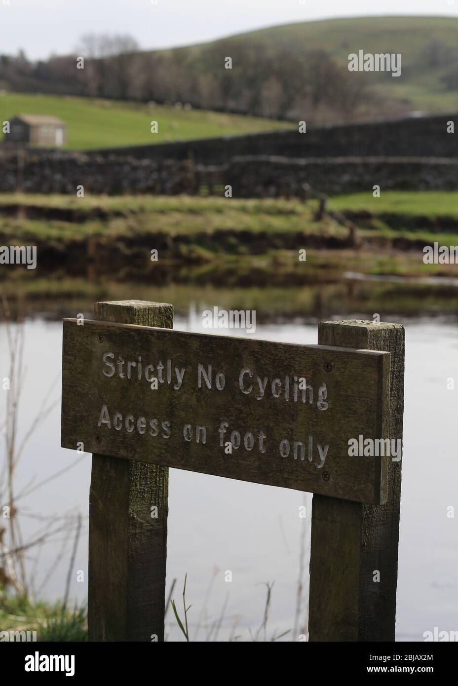 Old sign by a river Stock Photo - Alamy