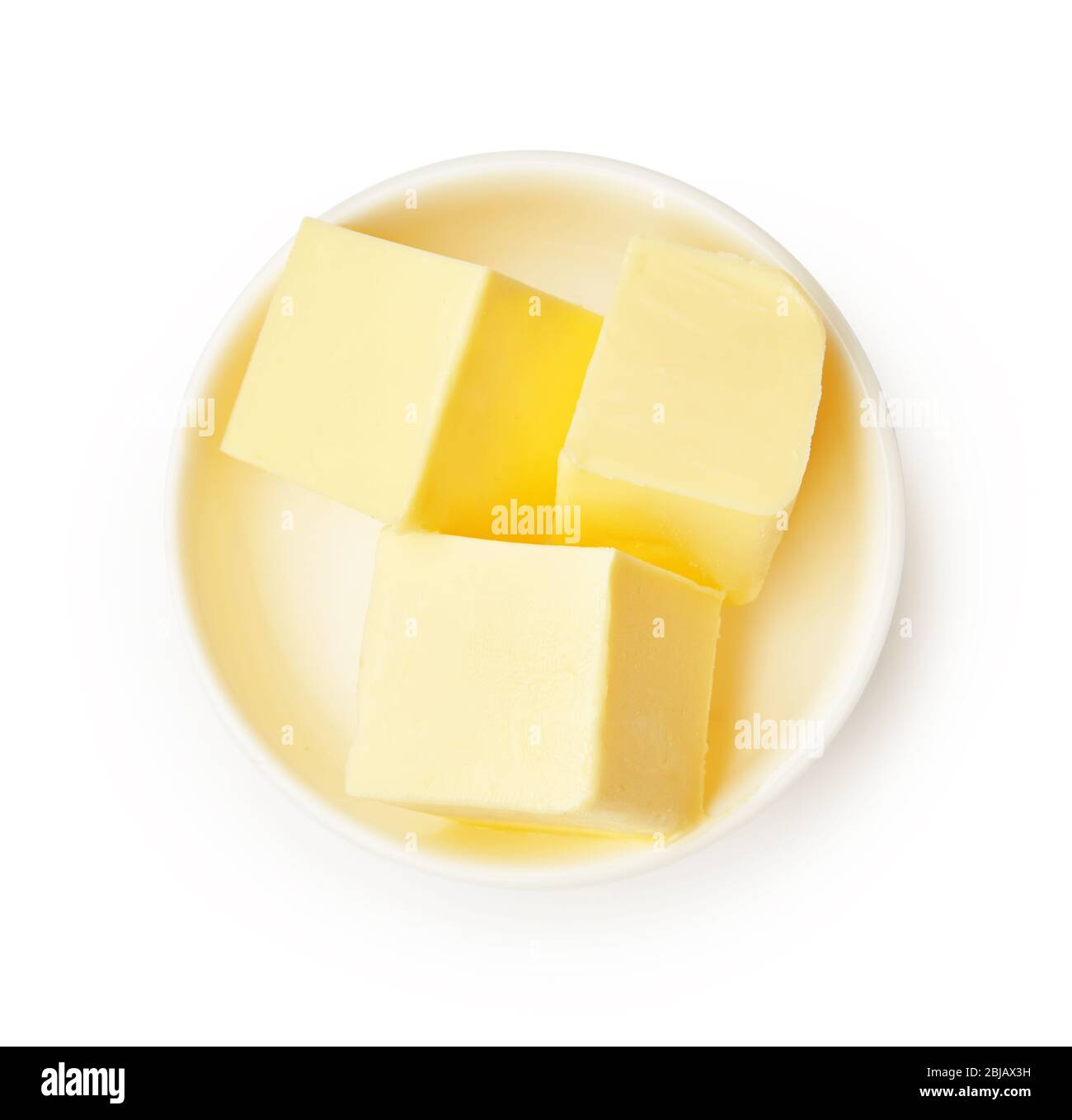 Butter pieces in white bowl isolated on white background. Butter cubes ...