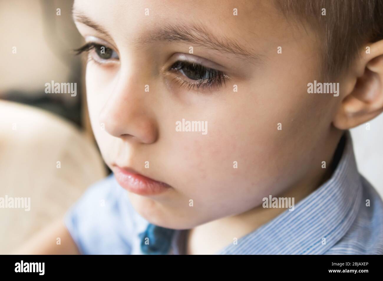 Boy face close up sad hi-res stock photography and images - Alamy