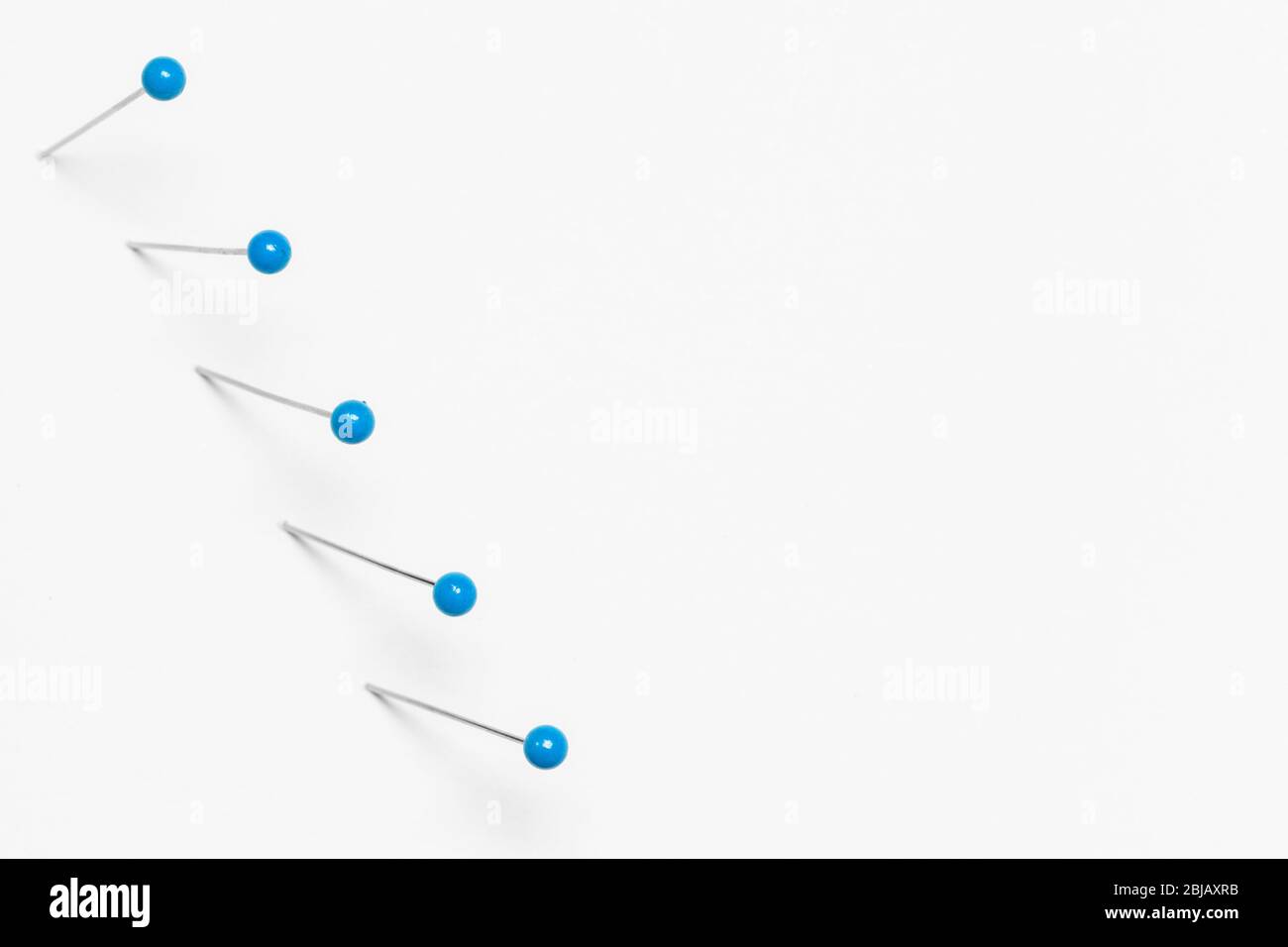 Group of pushpins isolated over white background Stock Photo - Alamy