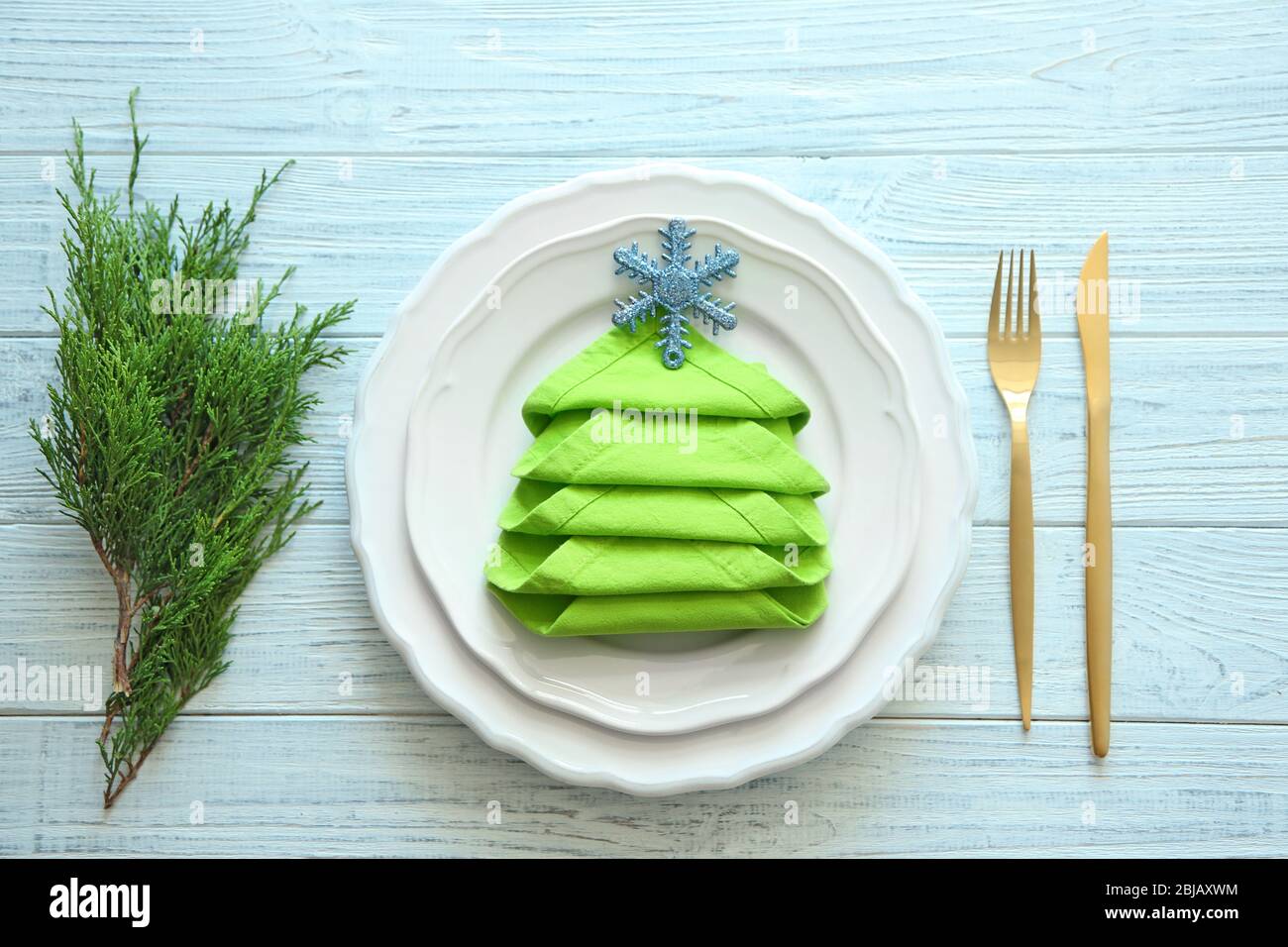 Christmas table setting on wooden background Stock Photo - Alamy
