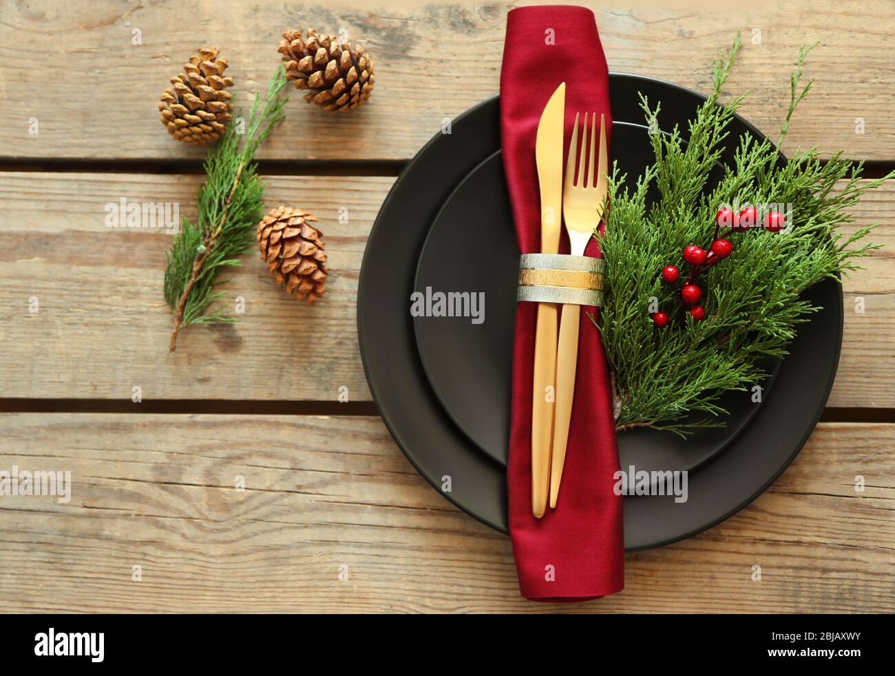 Christmas table setting on wooden background Stock Photo - Alamy