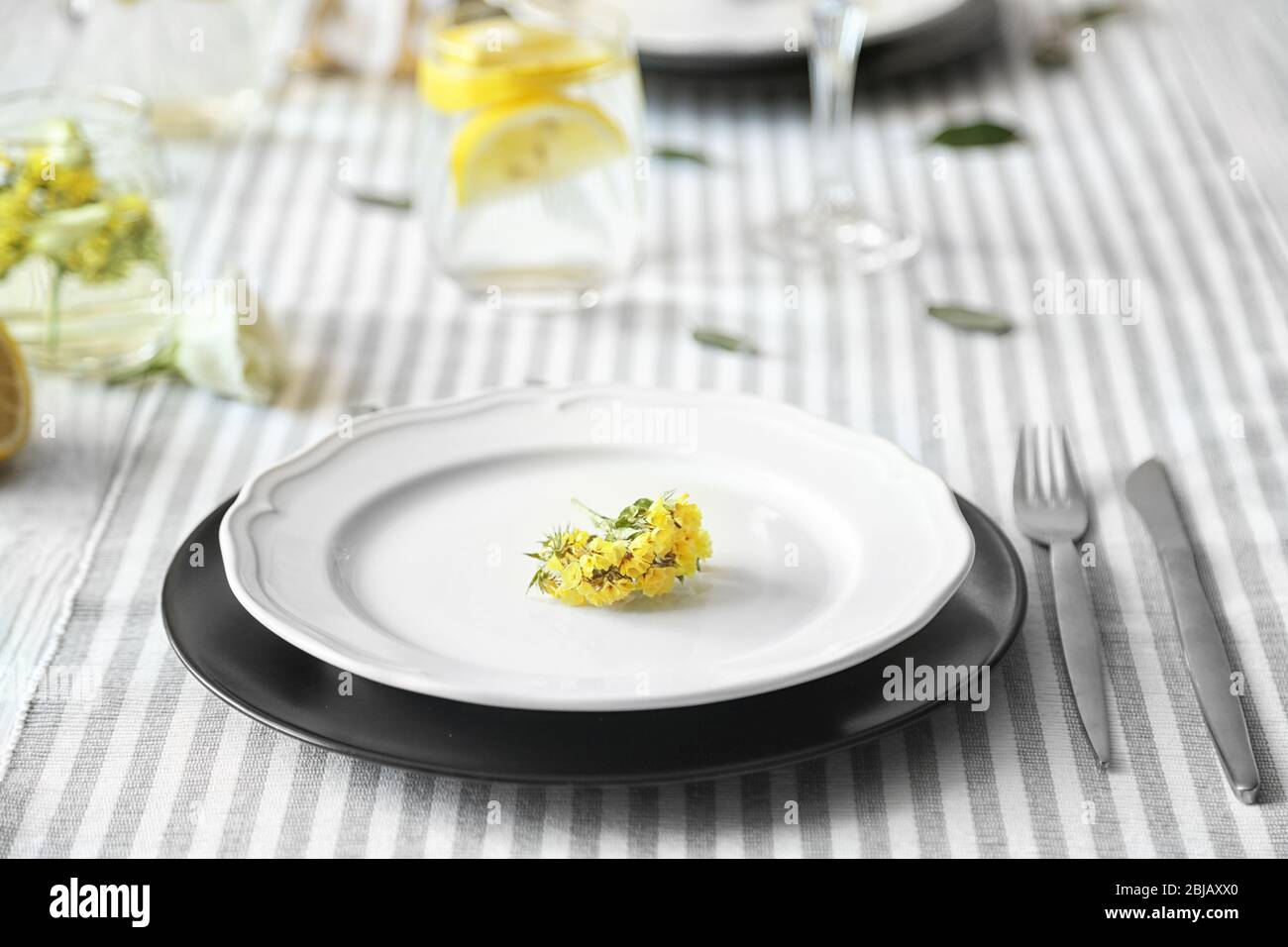 Table setting on tablecloth Stock Photo - Alamy