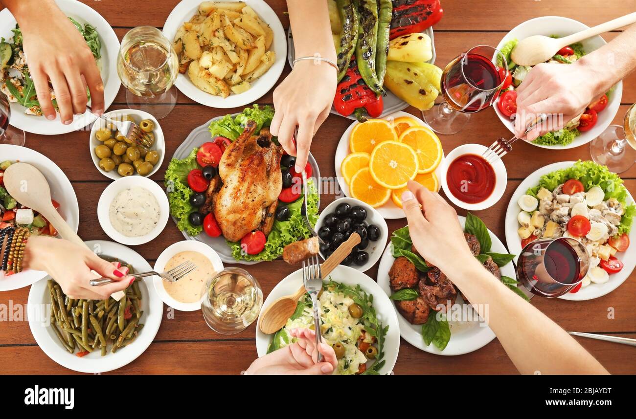 Friends eating in restaurant Stock Photo - Alamy