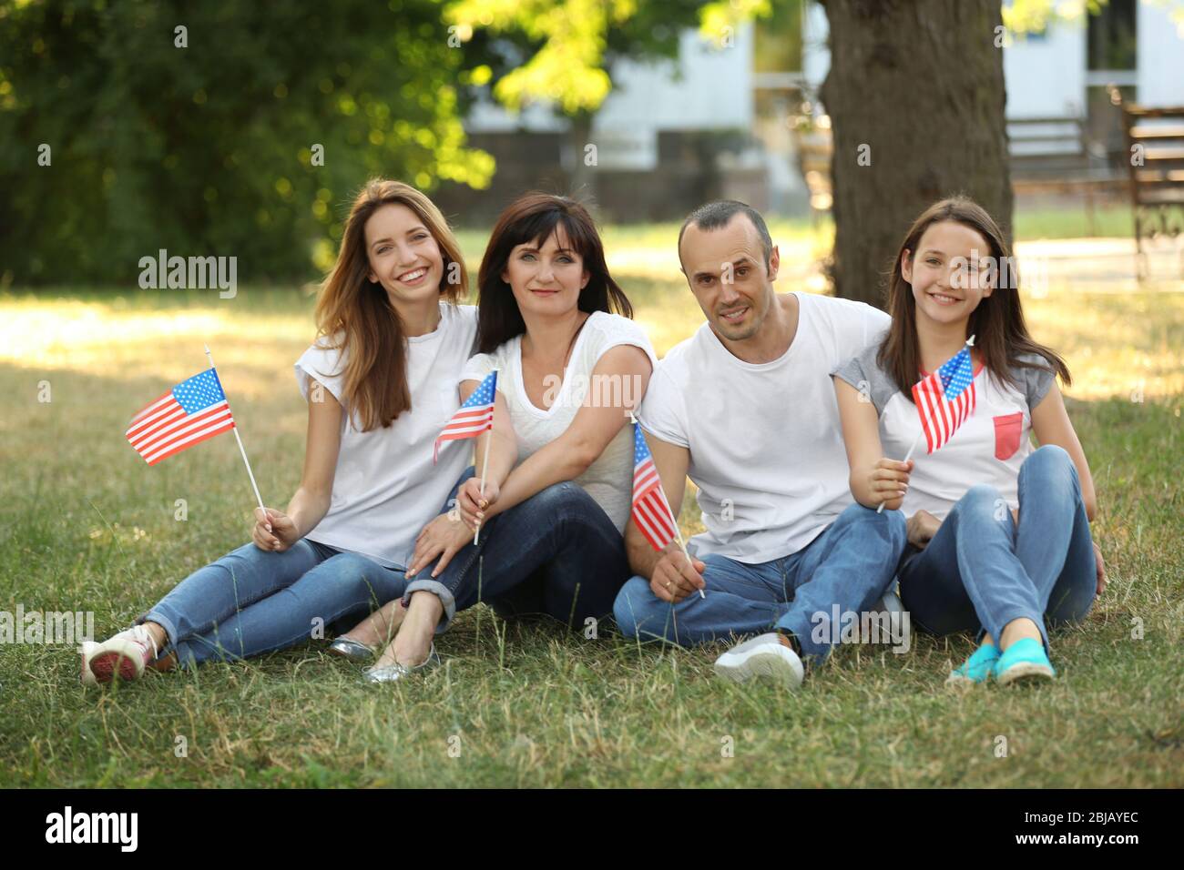 Holding usa flags sitting hi-res stock photography and images - Alamy