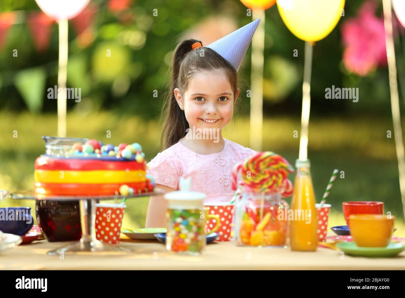 Cute girl on birthday party Stock Photo - Alamy