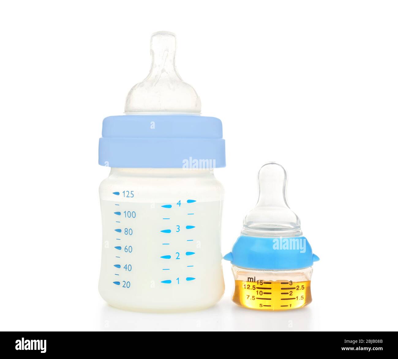 Feeding bottle with baby milk formula and bottle with medicine on white ...