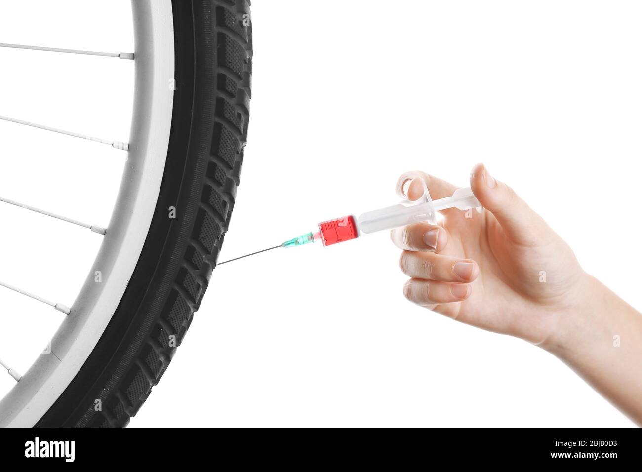 Female hand with syringe and bicycle wheel. Doping in sport concept ...