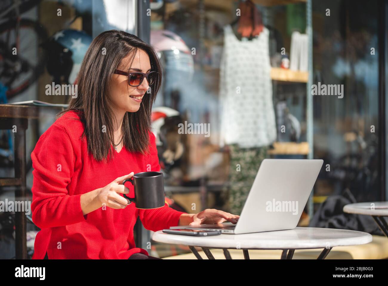 Beautiful young woman having Zoom video conference call via computer ...