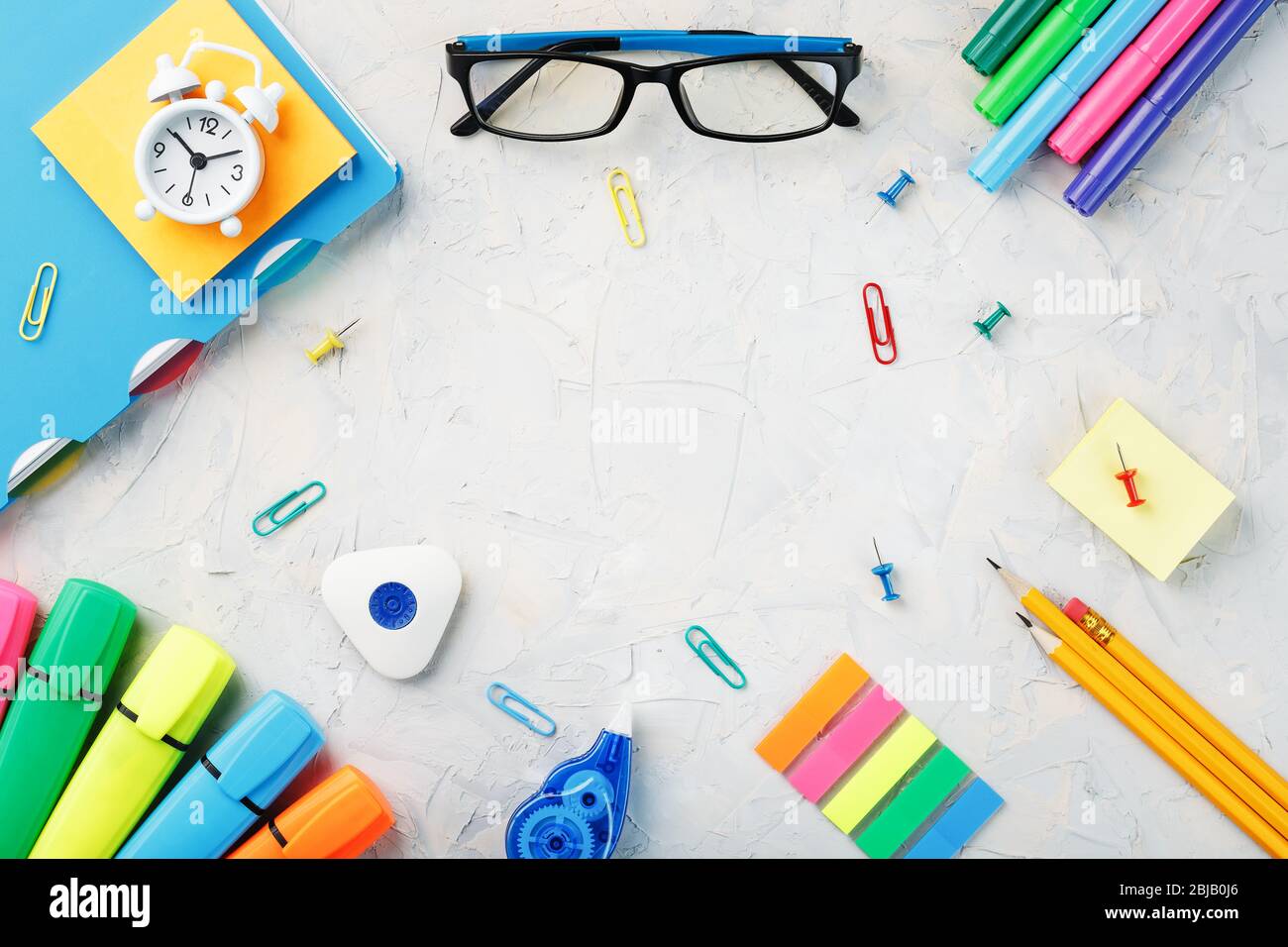 Student equipment on a gray textural background. Back to school concept ...