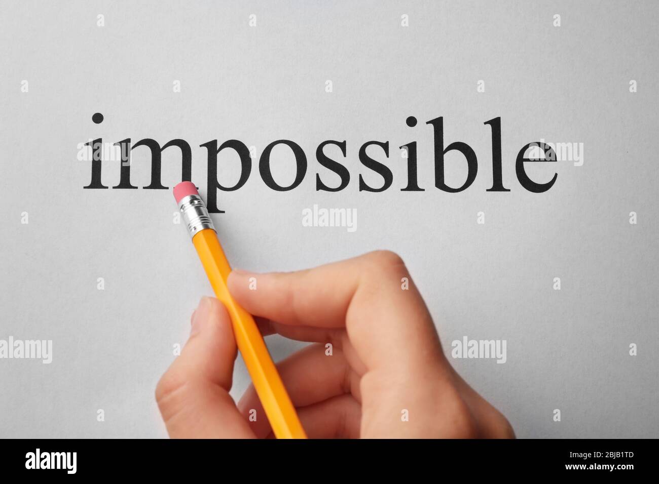 Hand erasing word impossible on paper Stock Photo - Alamy Hand erasing word impossible on paper Stock Photo - Alamy