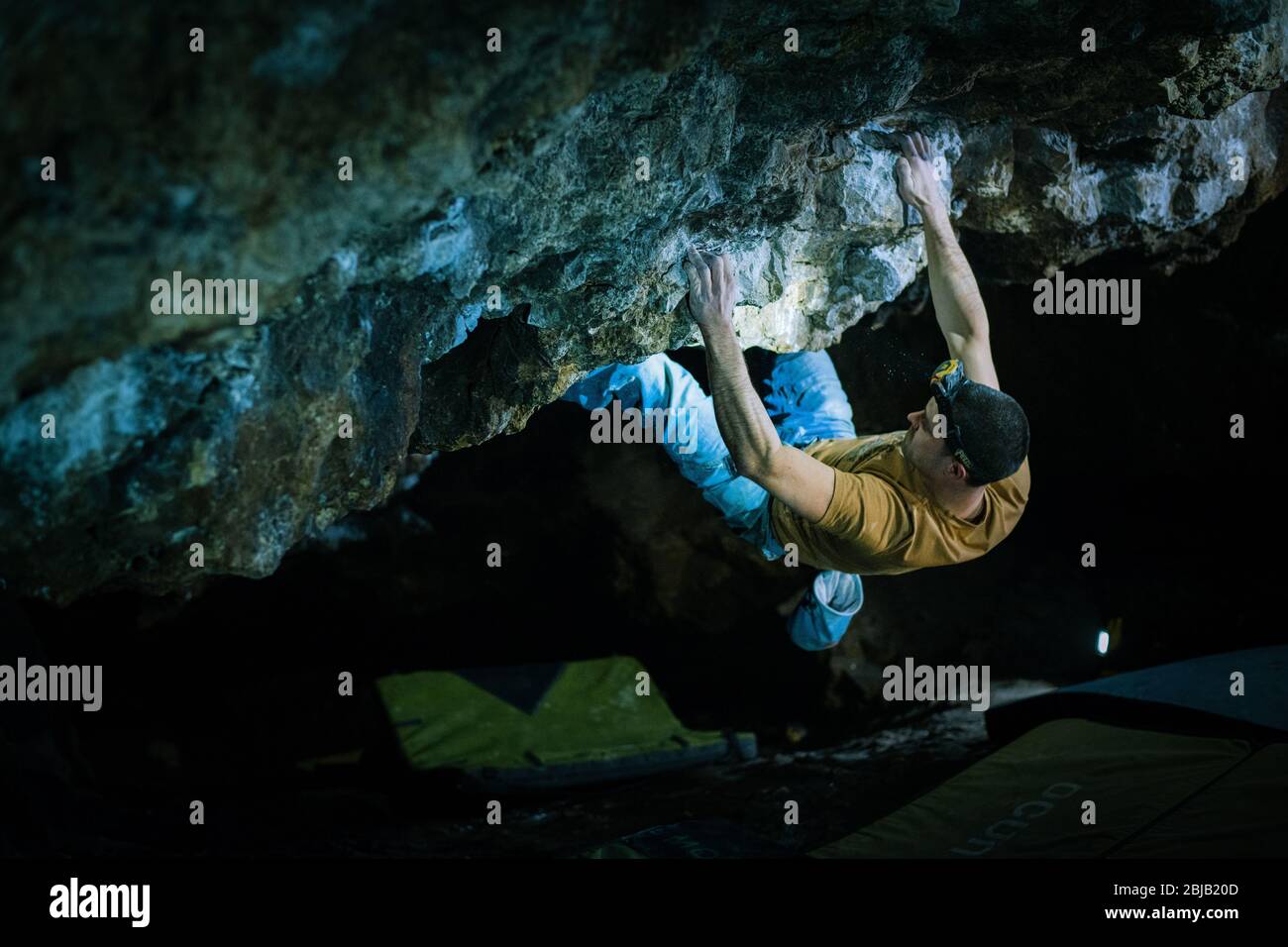 Man is making a boulder in Twardowski cave. Bouldering in rock ...