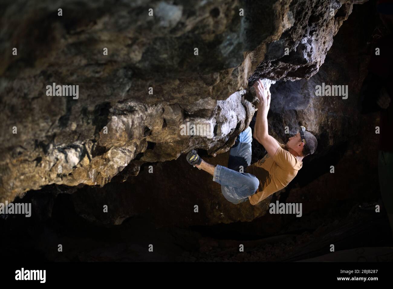 Man is making a boulder in Twardowski cave. Bouldering in rock ...