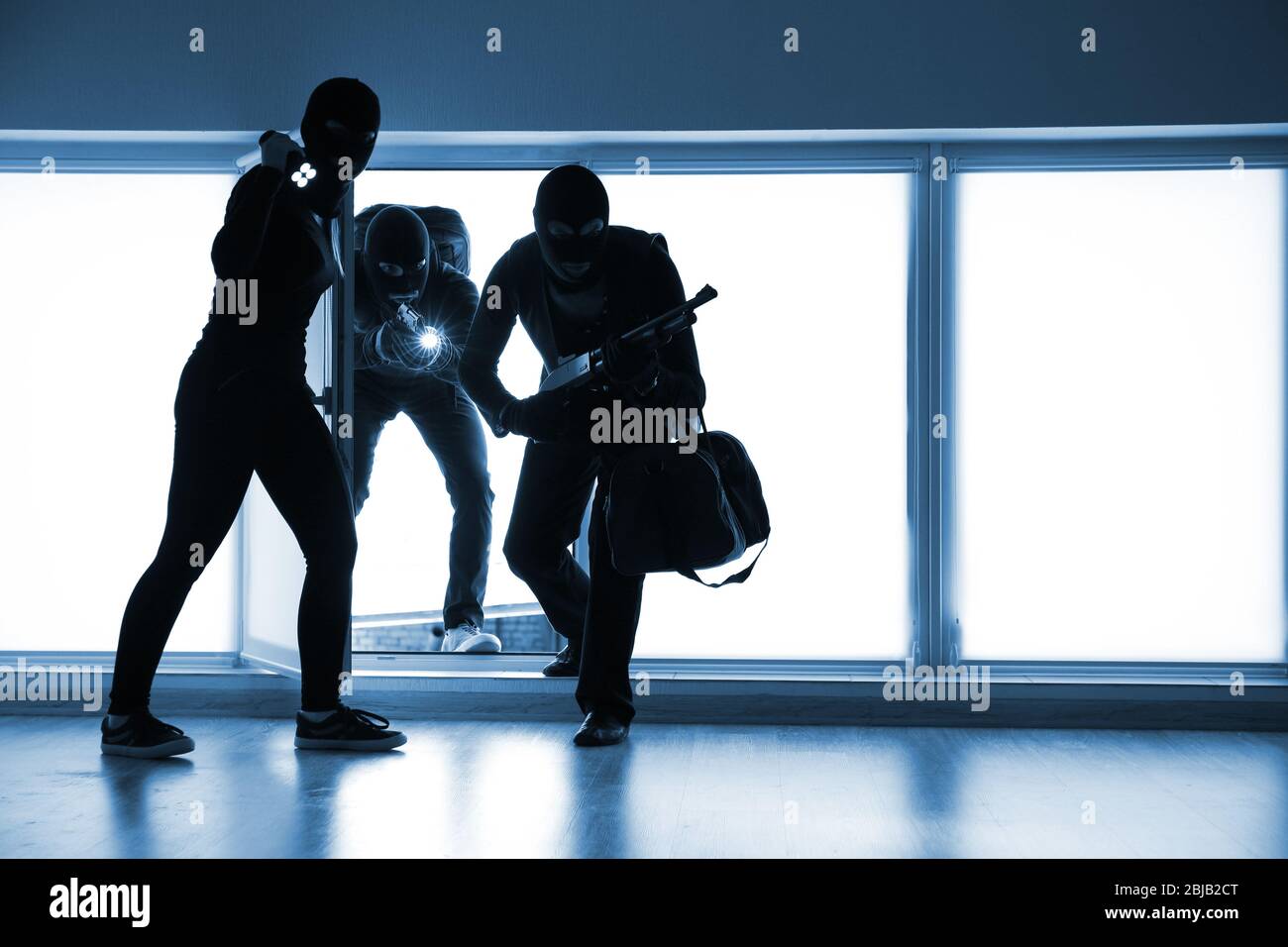 Burglar entering dark room hi-res stock photography and images - Alamy