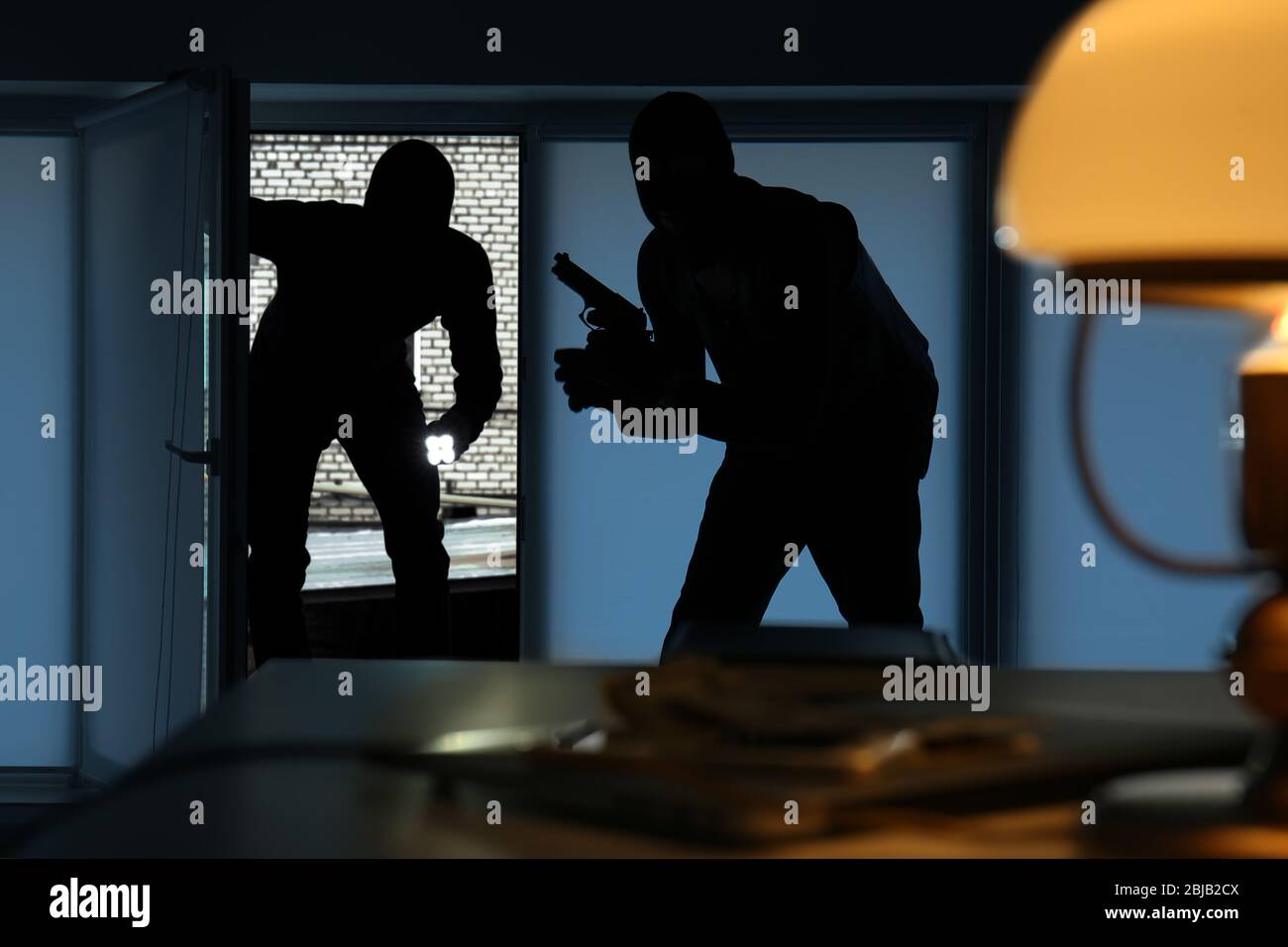 Armed thieves entering a house Stock Photo - Alamy