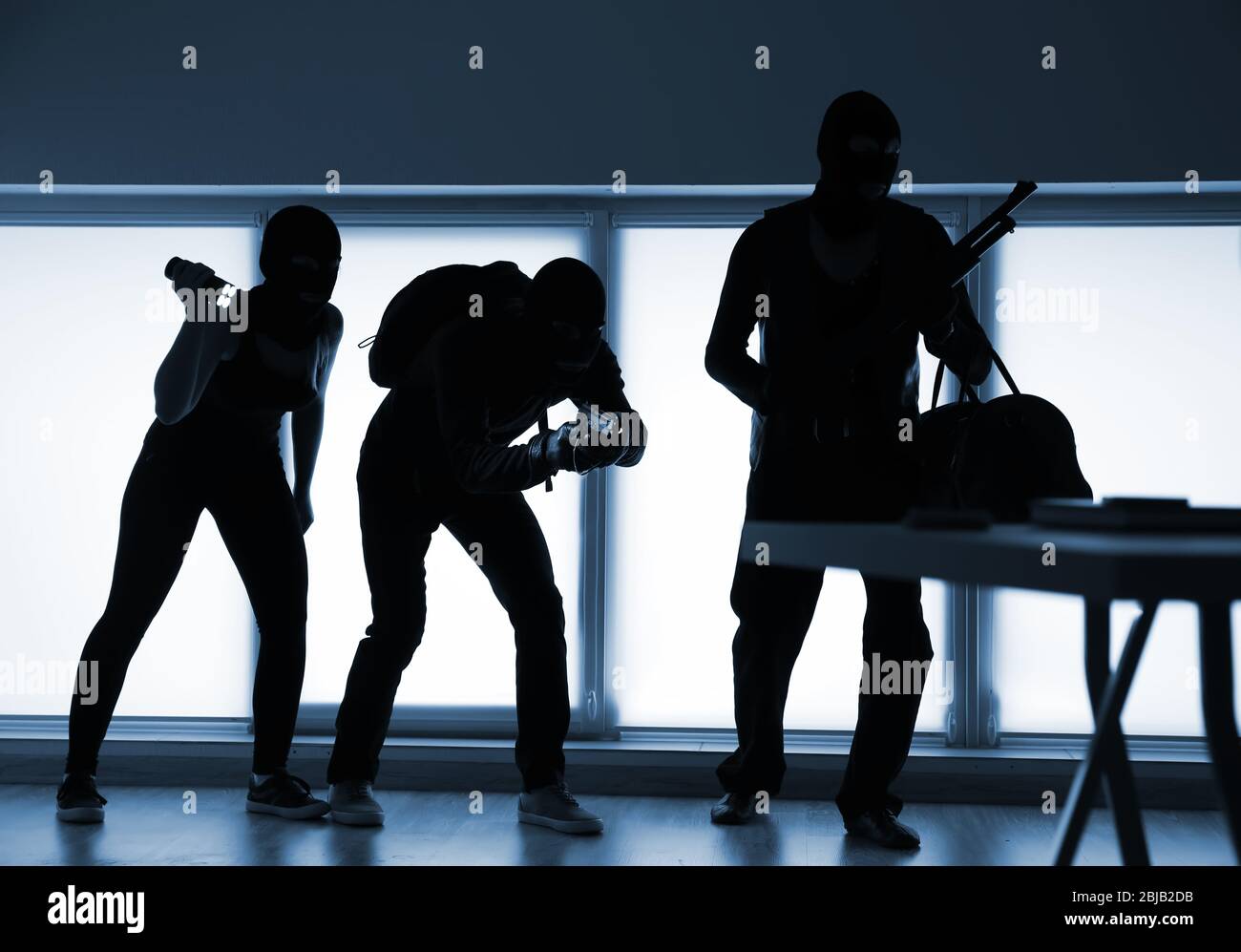 Armed thieves entering a house Stock Photo - Alamy