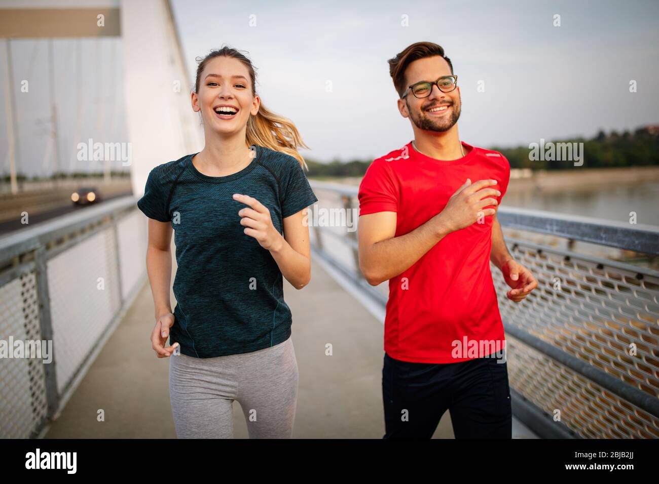 Young people running and exercising. Living healthy sporty lifestyle ...