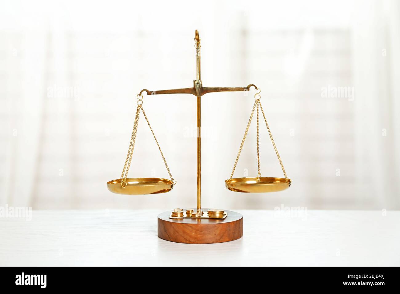 Law scales on a table Stock Photo - Alamy
