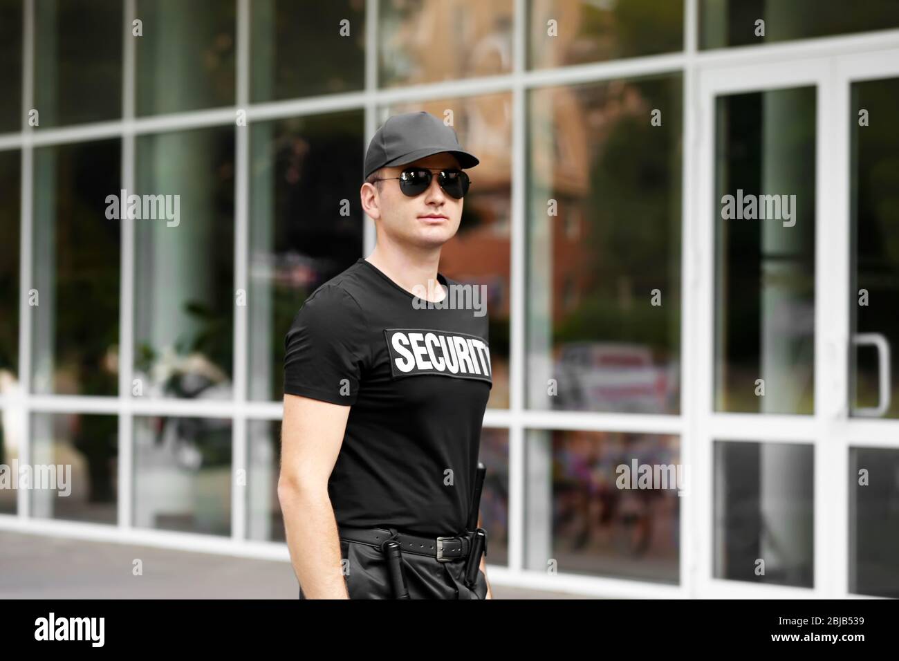 Male security guard outdoors Stock Photo - Alamy