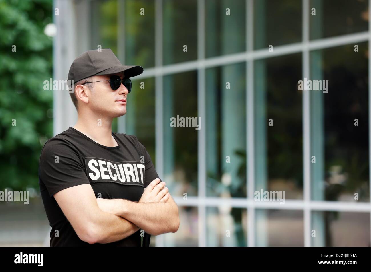 Male security guard outdoors Stock Photo - Alamy