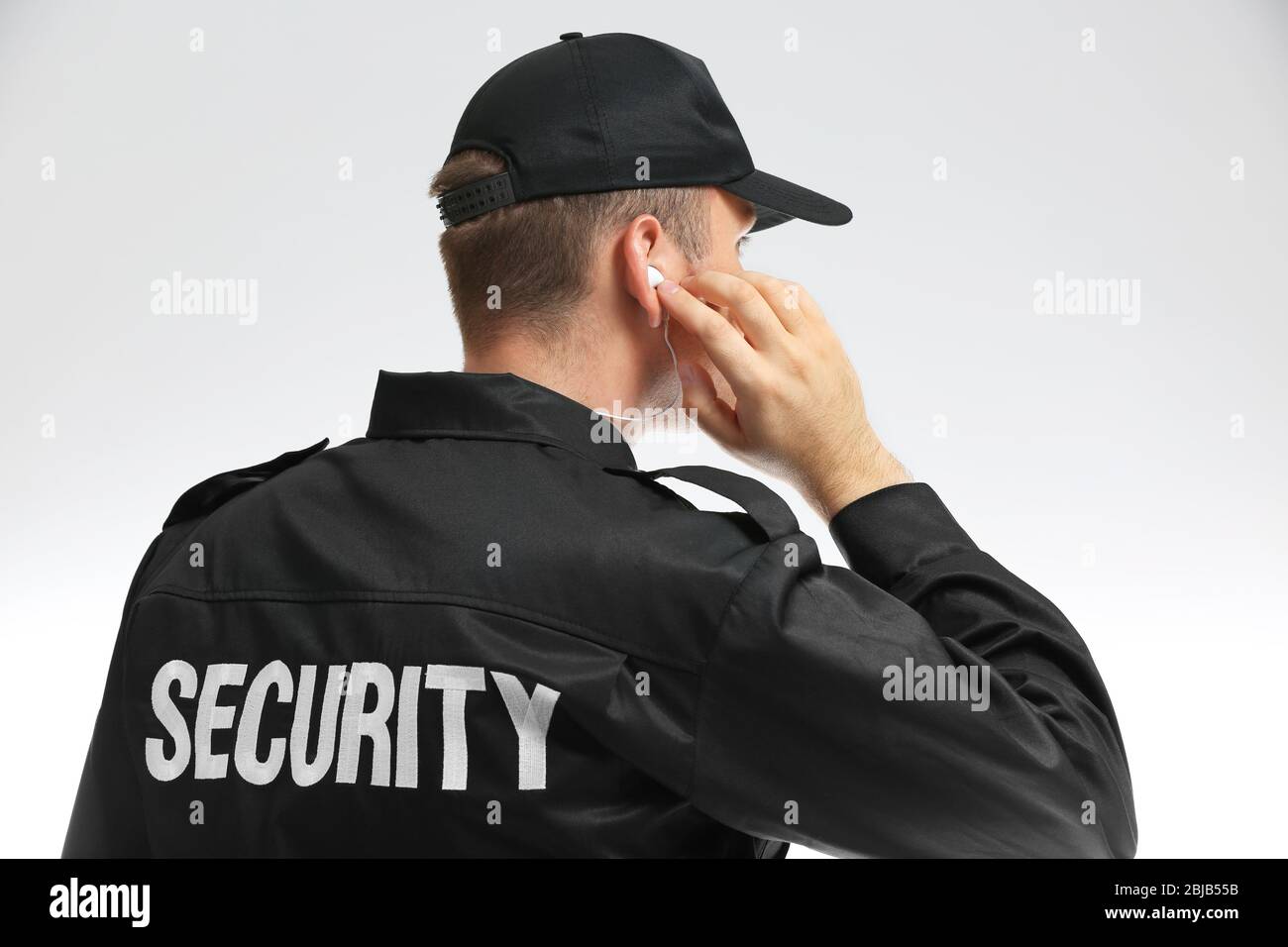 Male security guard isolated on white Stock Photo - Alamy