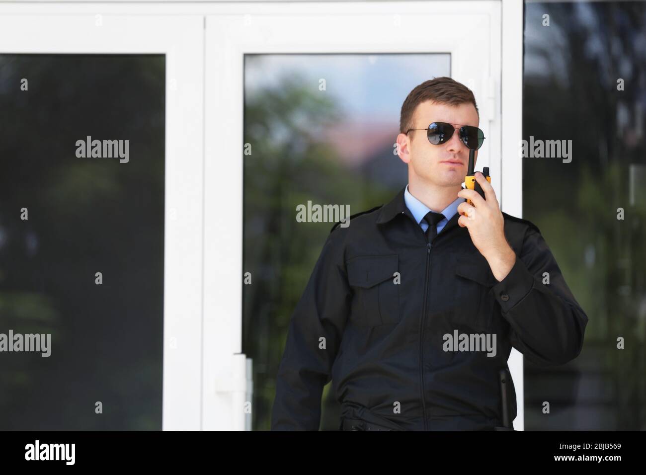 Male security guard outdoors Stock Photo - Alamy