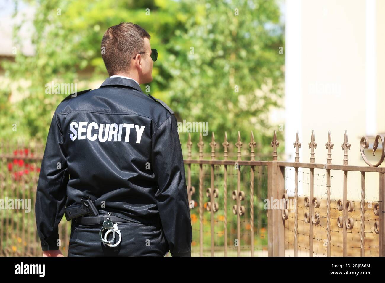 Male security guard outdoors Stock Photo - Alamy