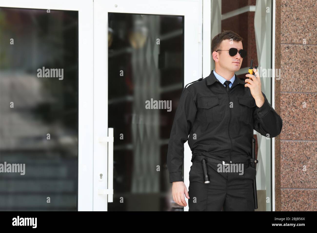 Male security guard outdoors Stock Photo - Alamy