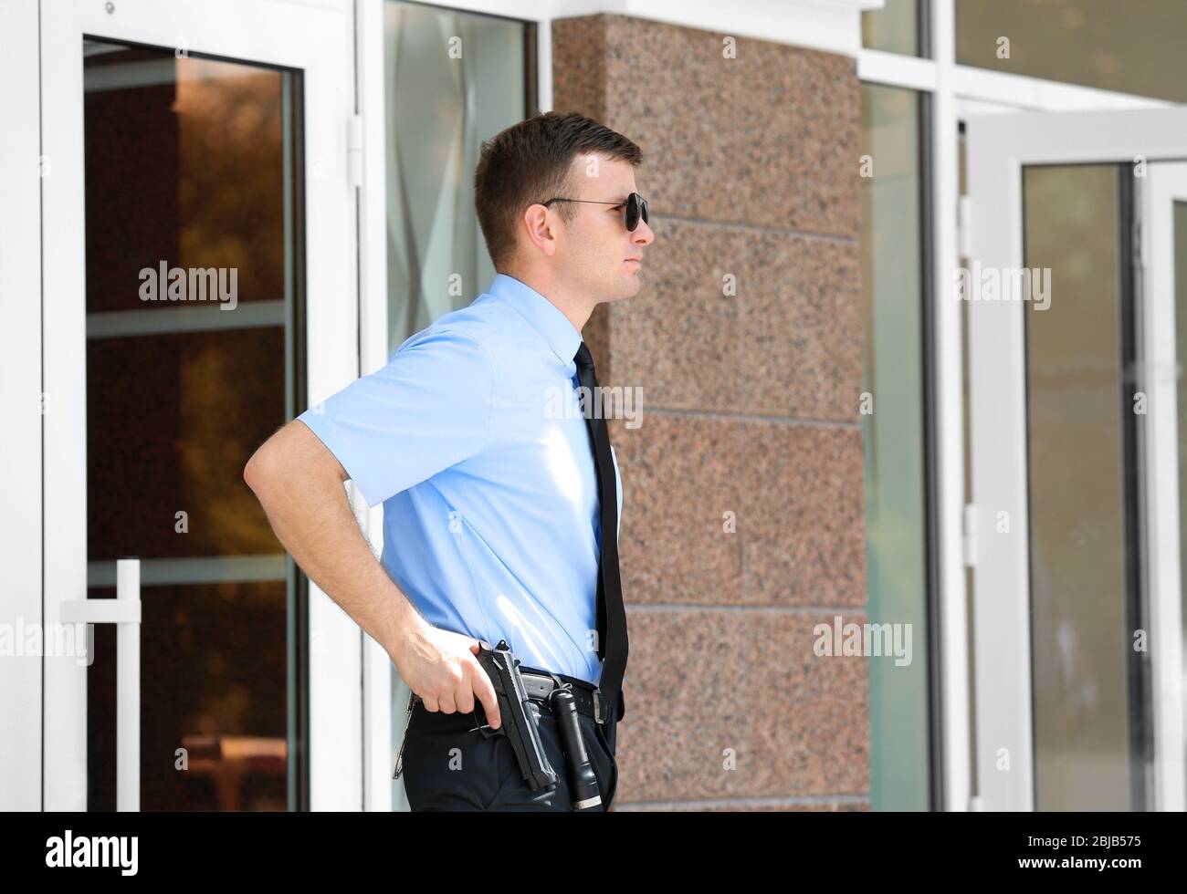 Male security guard outdoors Stock Photo - Alamy