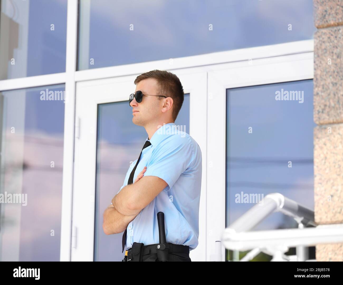 Male security guard outdoors Stock Photo - Alamy
