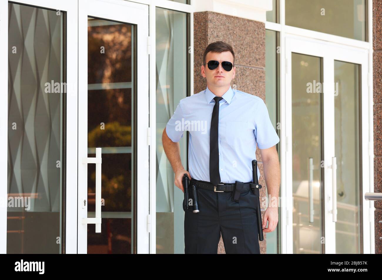 Male security guard outdoors Stock Photo - Alamy