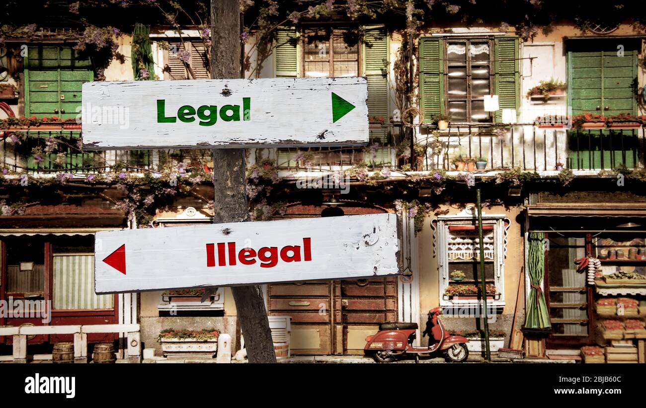 Street Sign the Direction Way to Legal versus Illegal Stock Photo - Alamy