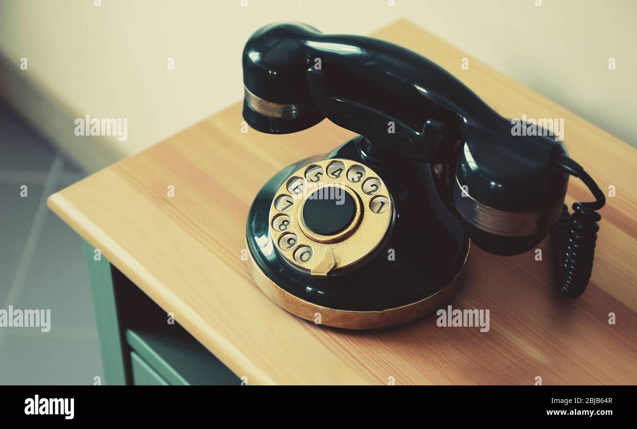 Old telephone on table, closeup Stock Photo - Alamy