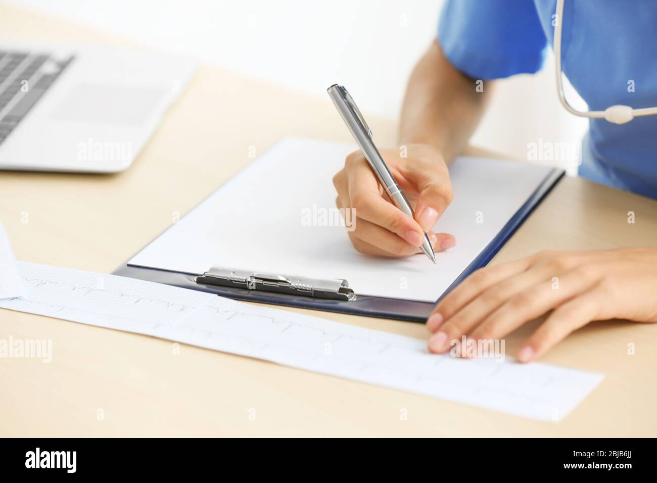 Female doctor writing blood pressure hi-res stock photography and ...