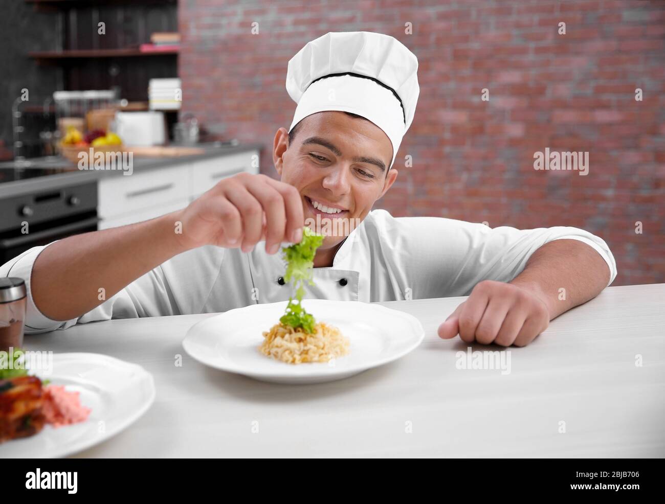Happy chef preparing pasta hi-res stock photography and images - Alamy