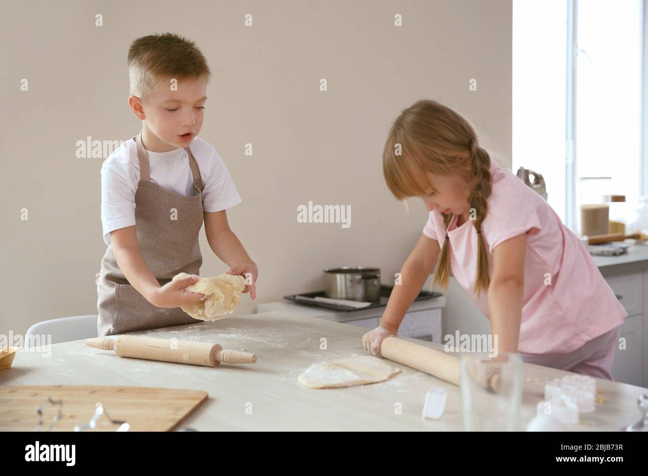 Kids making biscuits in kitchen Stock Photo - Alamy