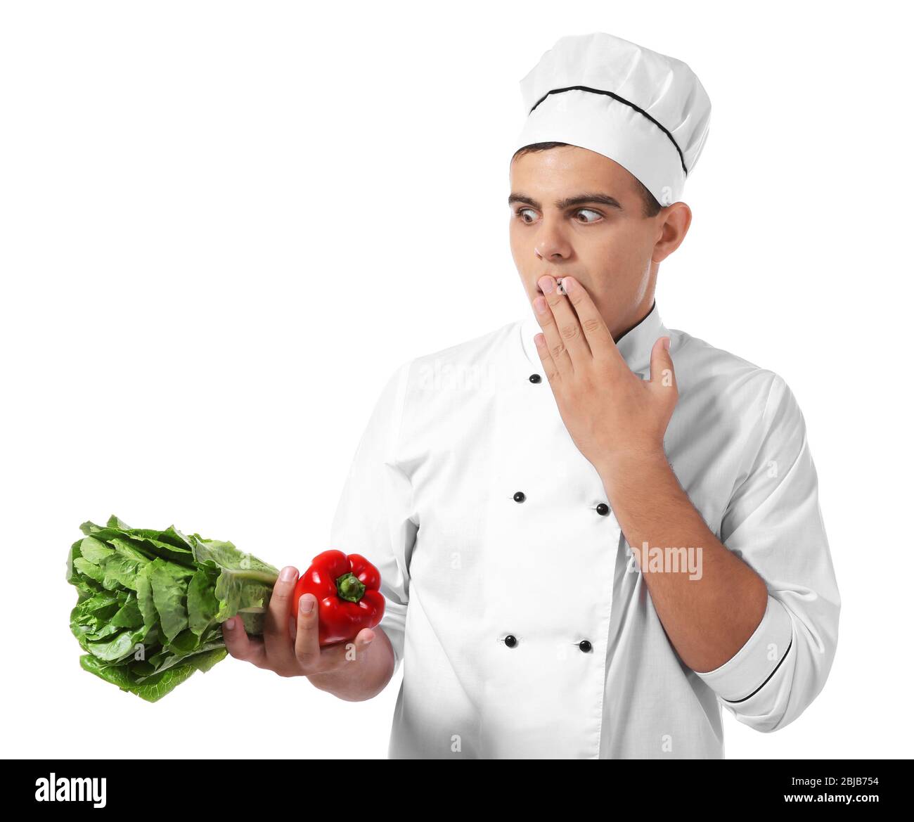 Young handsome chef cook with fresh vegetables isolated on white Stock ...