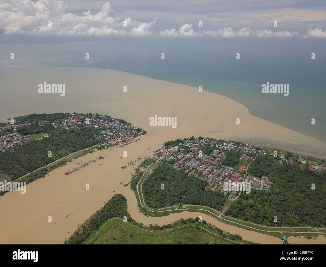 Aerial brown color Sungai Muda river at the border of Penang and Kedah ...