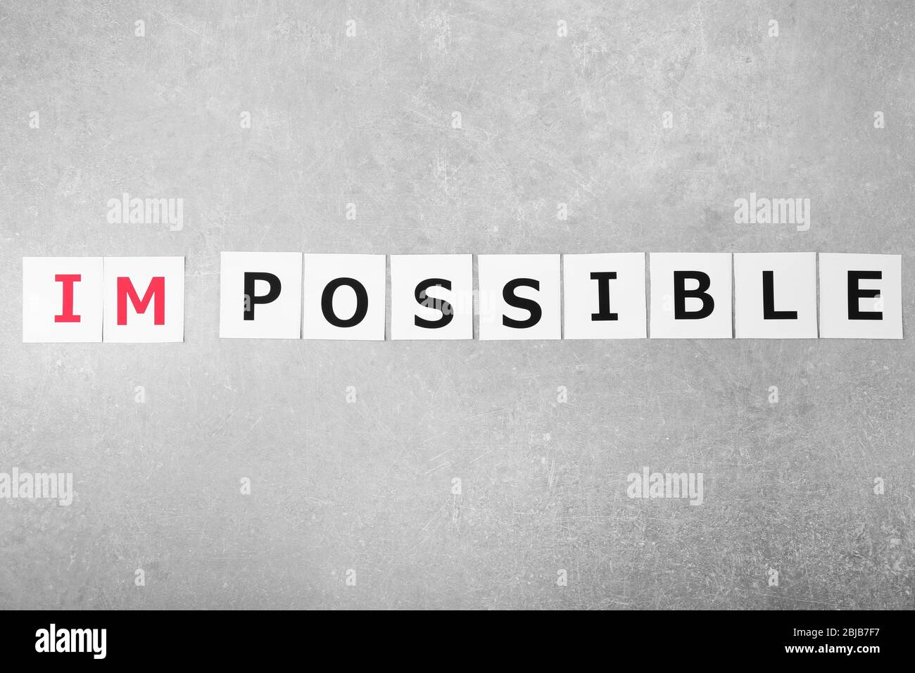 Turning word impossible into possible Stock Photo - Alamy